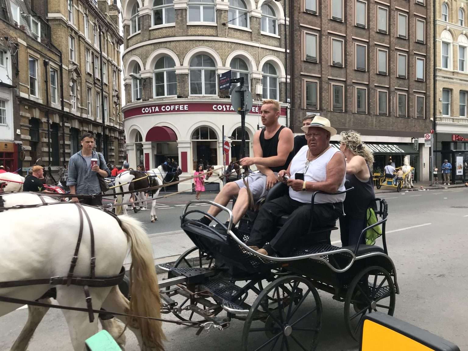 Roma and traveller people parade horses and carts through London Bridge ...